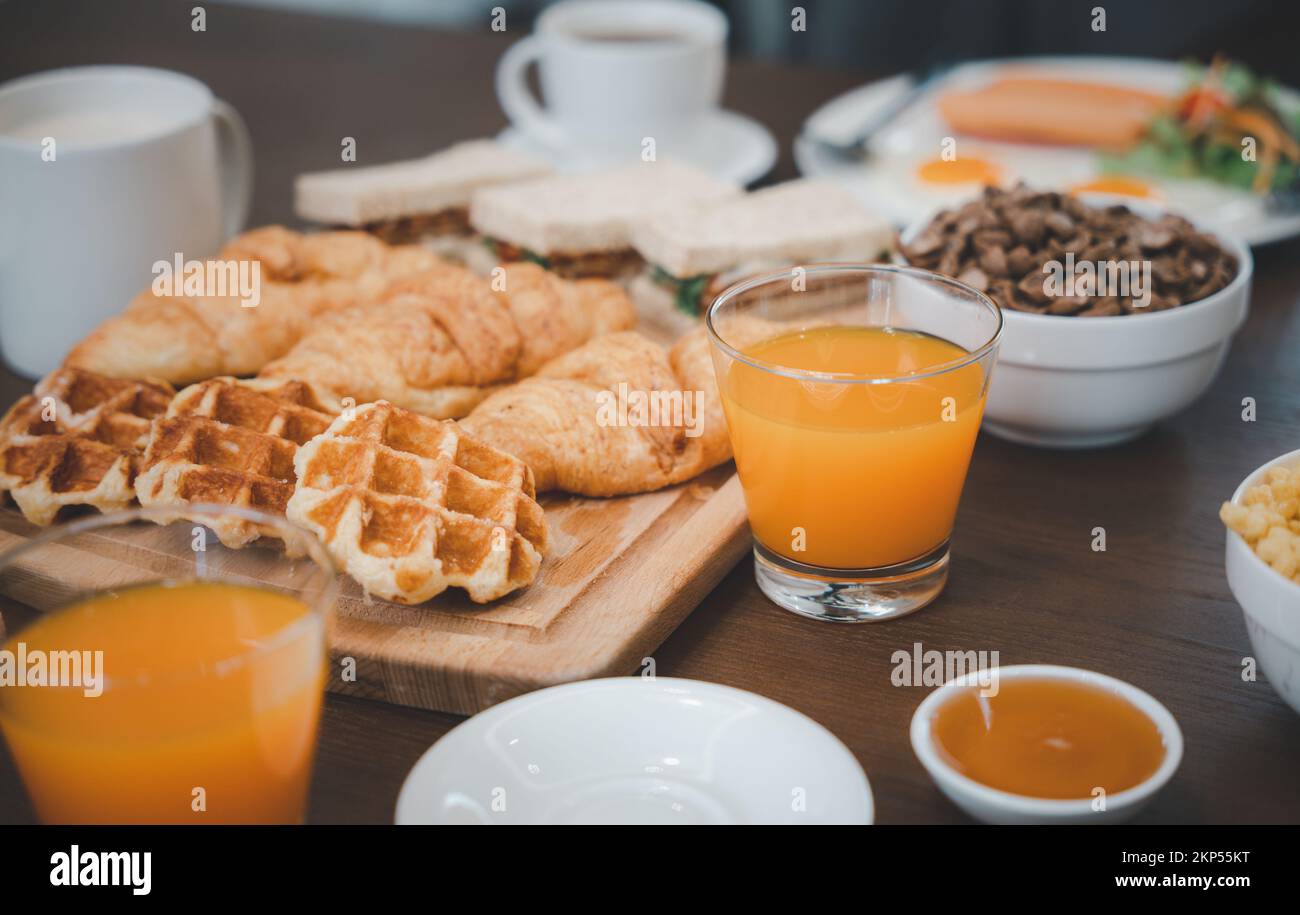 Breakfast served food with beverage coffee, orange juice on table in ...