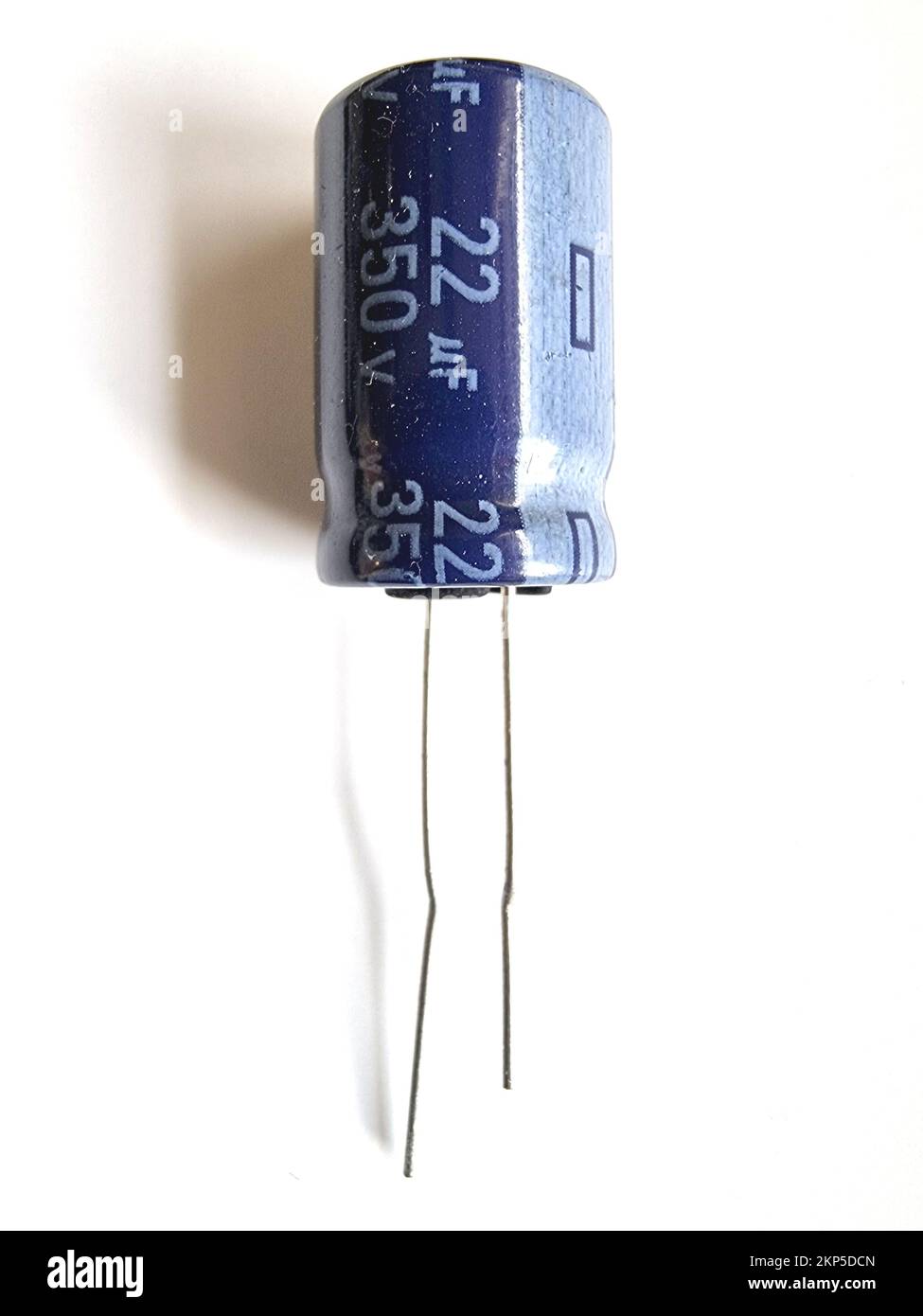 An electrolytic capacitor isolated on a white background Stock Photo ...