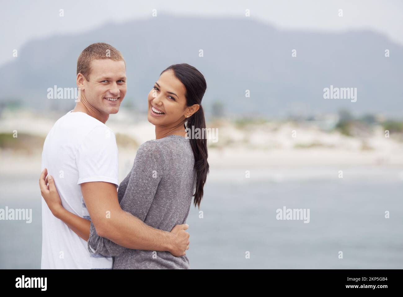 They can always make each other smile. a young couple looking at the ...