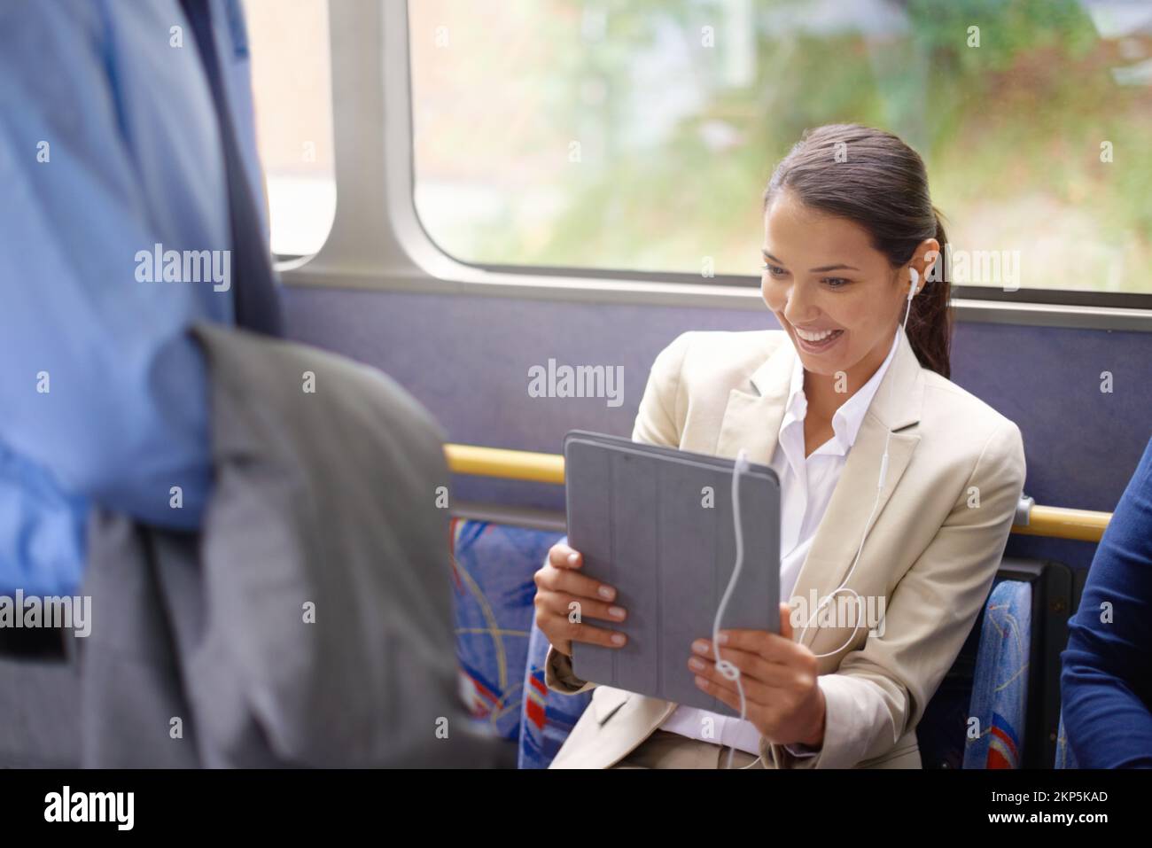 Traveling with my tablet. a young businesswoman commuting to work Stock ...