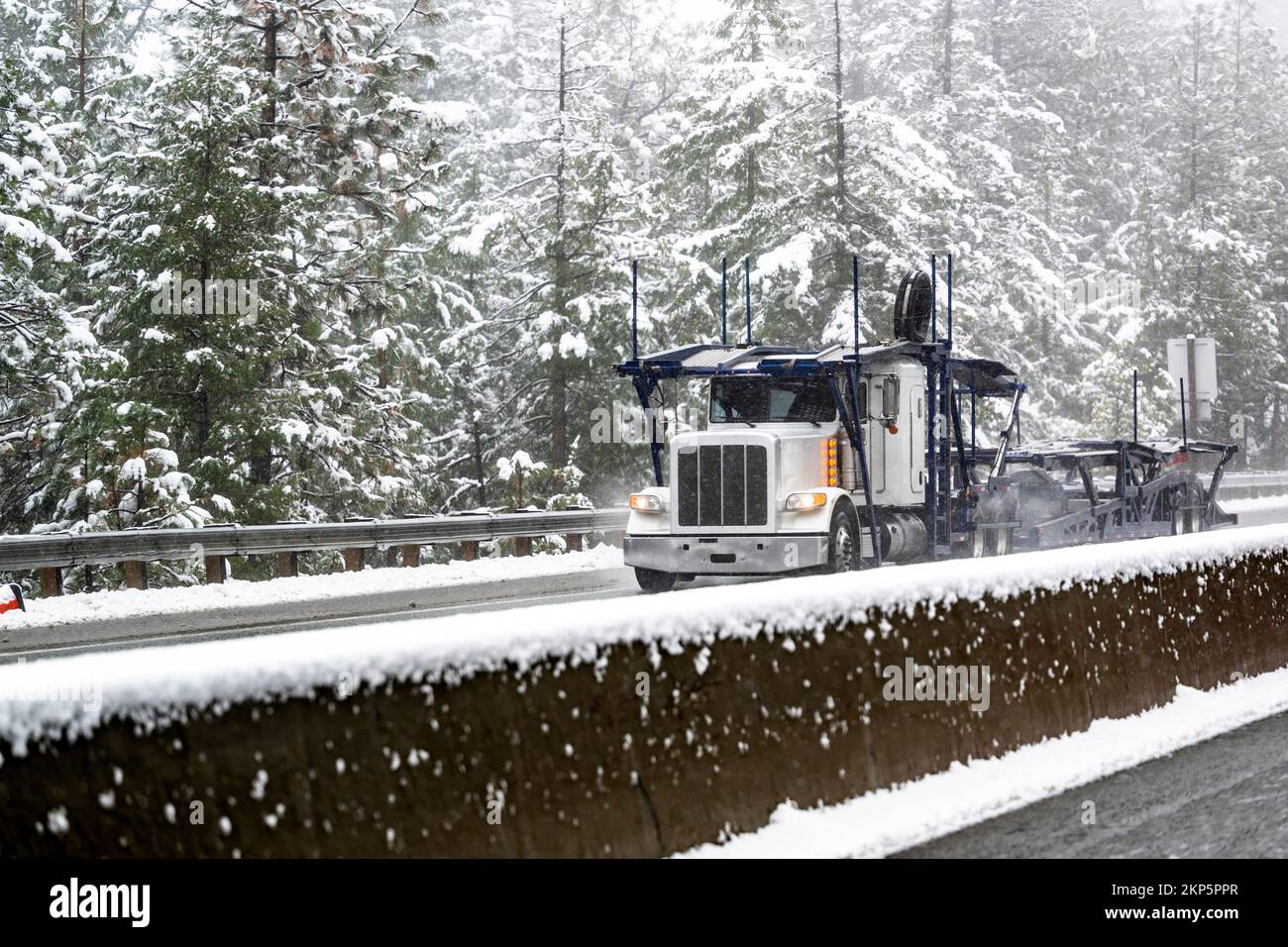 White classic big rig car hauler semi truck with empty two level ...