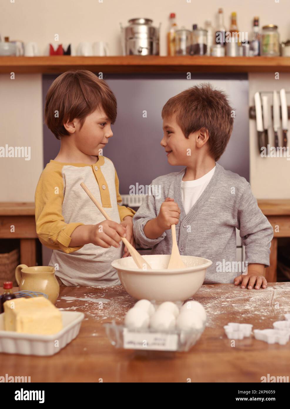 Lets stir together...two young brothers baking in the kitchen Stock ...