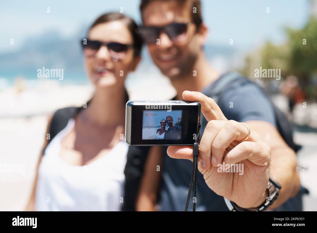 Making memories with a friend. a young couple taking a self-portrait at ...