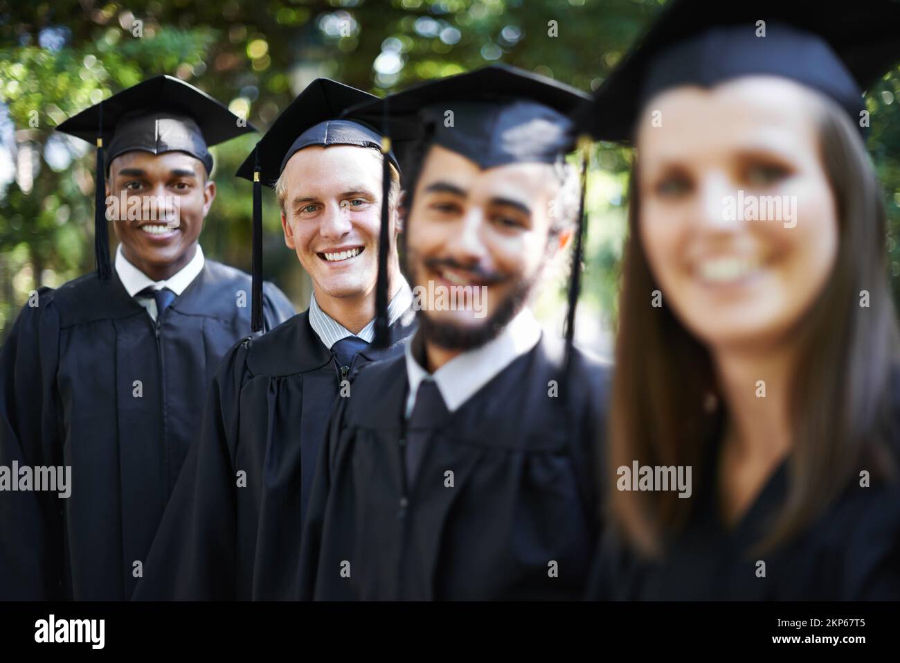 Happy graduates students standing hi-res stock photography and images ...