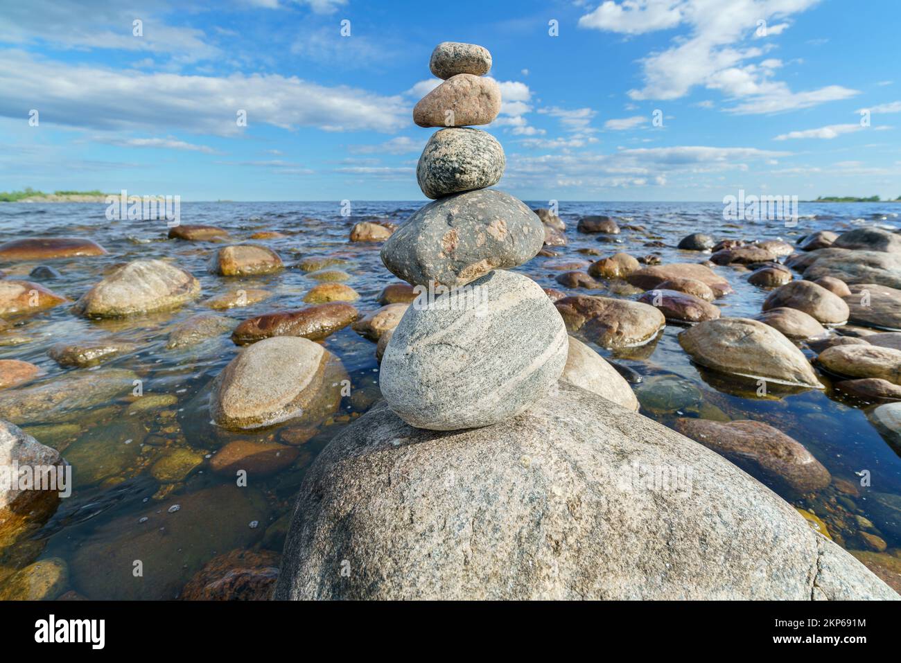 A closeup shot of a pyramid of stones with unstable balance on the ...