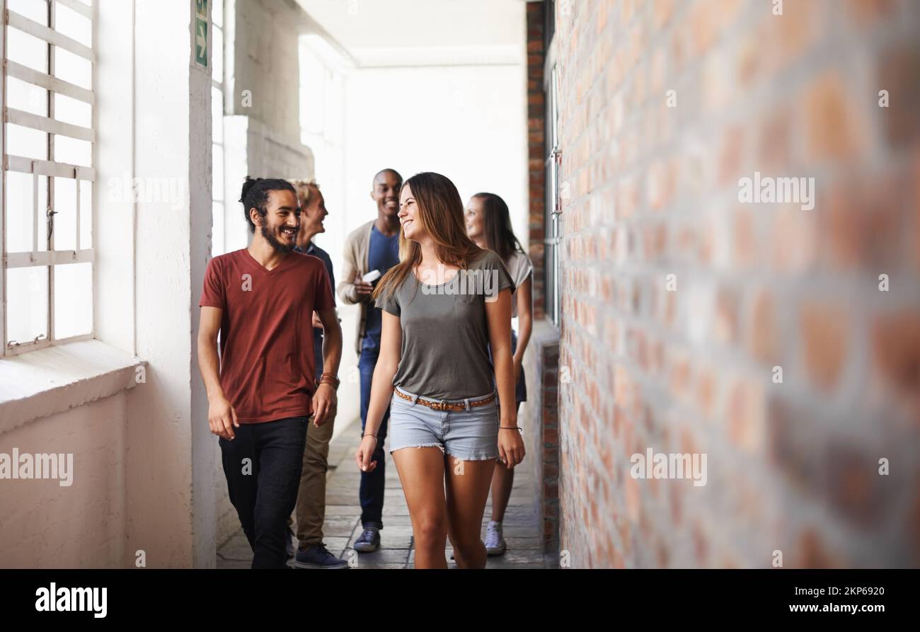 Class is finally over - time to head home. students conversing in the ...