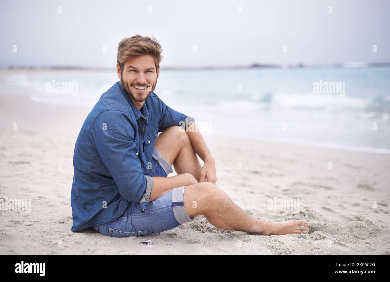 Everyday should be a holiday. a young man enjoying a day at the beach ...