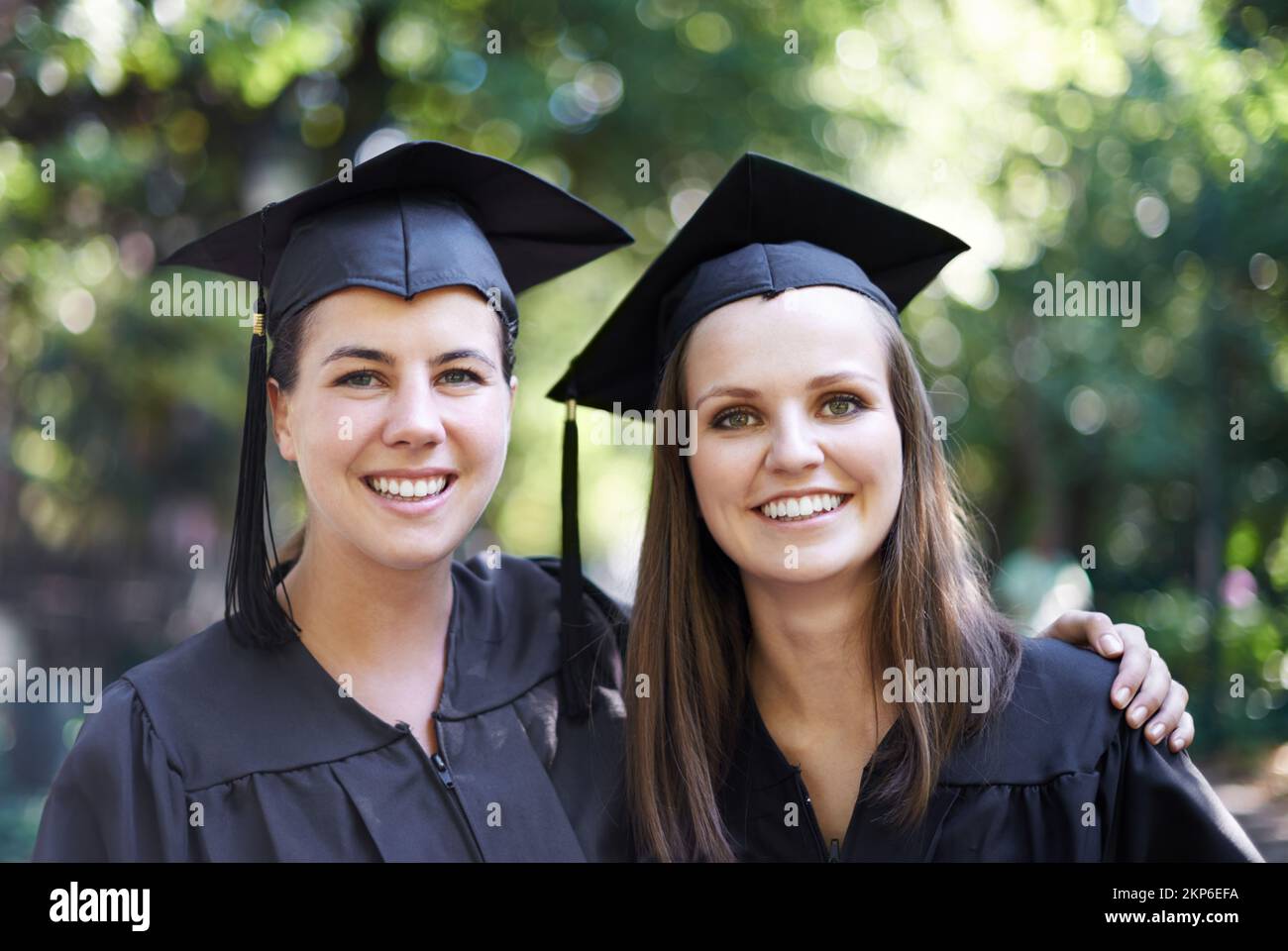 Two happy female graduates wearing hi-res stock photography and images ...