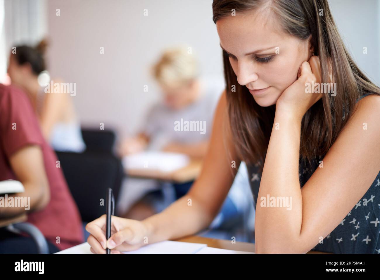 Total dedication to learning. a group of university students studying ...