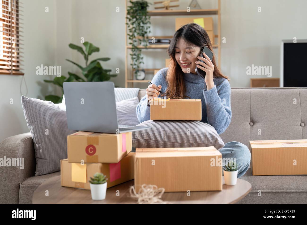 Small business entrepreneur SME freelance woman using phone call ...