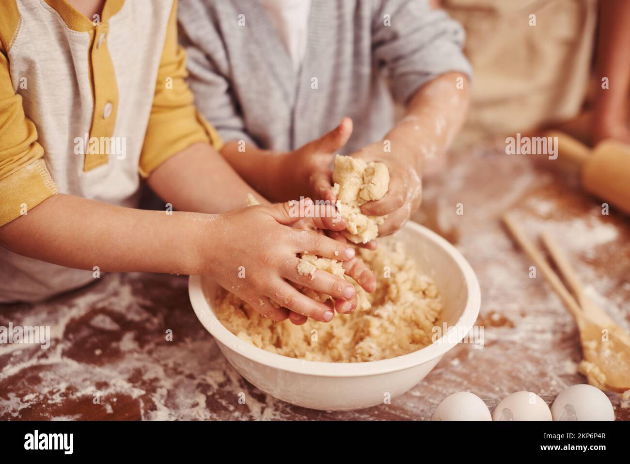 Baking brothers. two young brothers baking in the kitchen Stock Photo ...