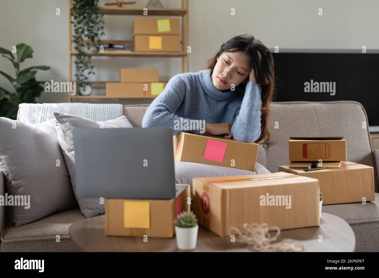 Asian woman feel worry stress and headache during waiting new order ...