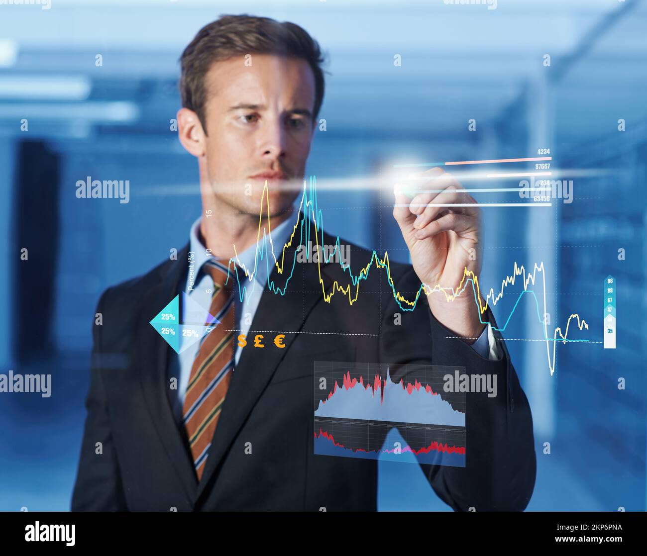 Corporate visionary at work. a handsome young businessman using a ...