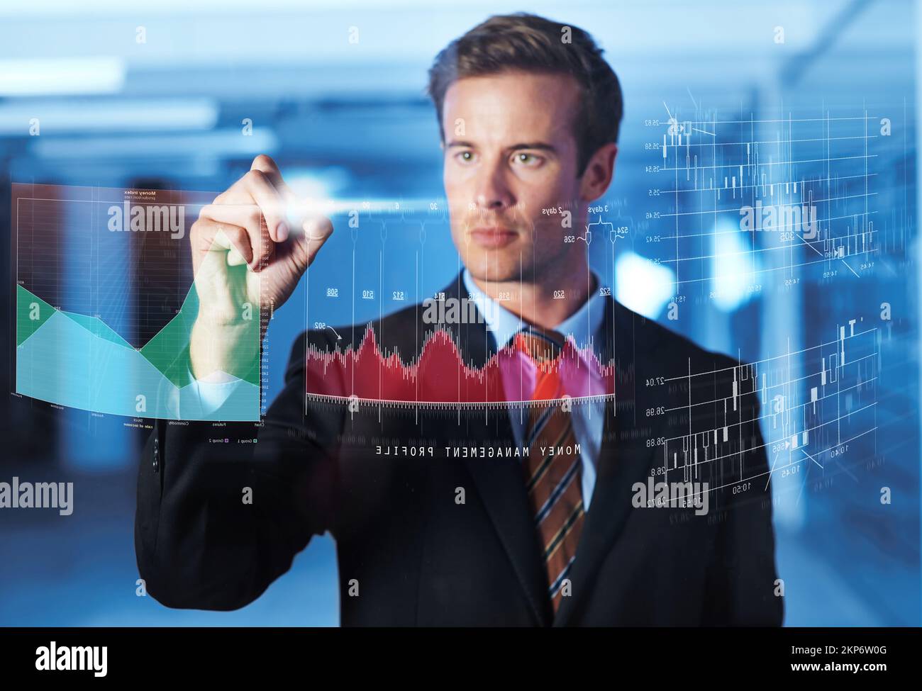 Corporate knowledge at his fingertips. a handsome young businessman ...