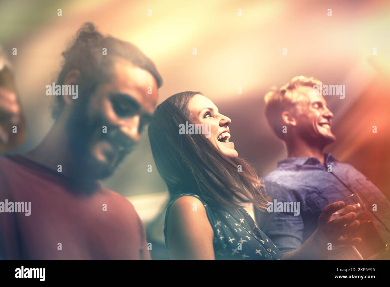 Good times with good friends. friends drinking and having fun in a pub ...