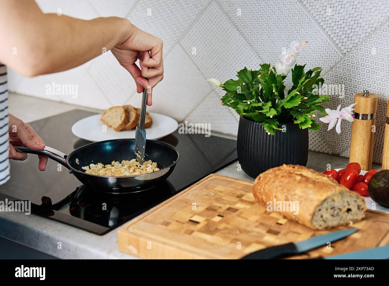 Process of woman cooking breakfast at kitchen. Female hands preparing ...