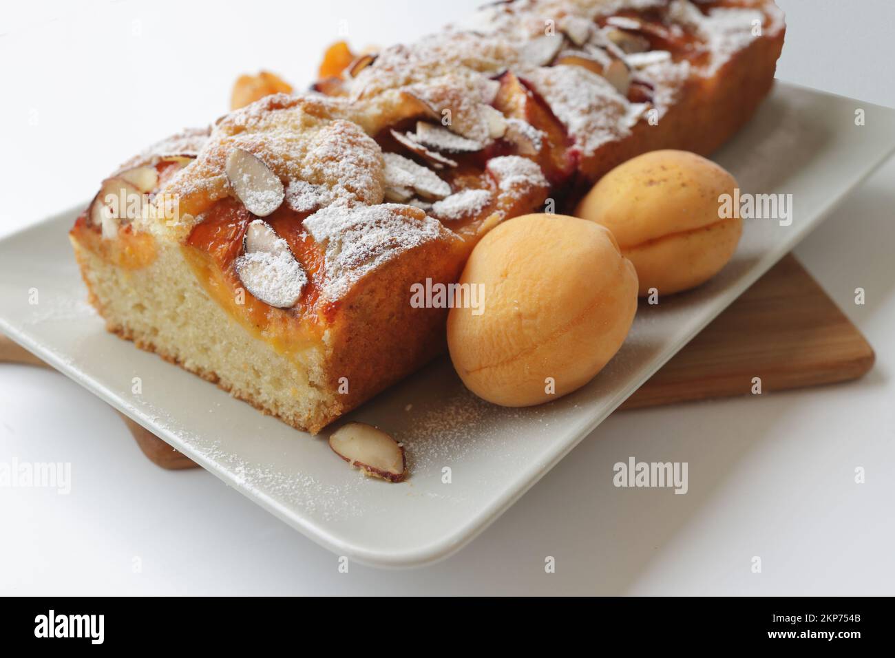 rectangular appetizing homemade apricot pie on a rectangular plate, on ...