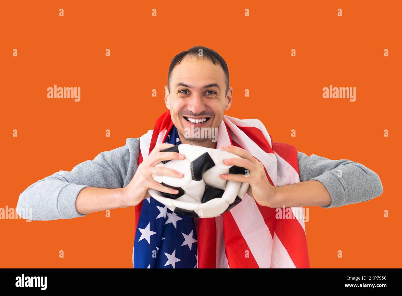 football fan with a deformed crumpled ball and an American flag Stock ...