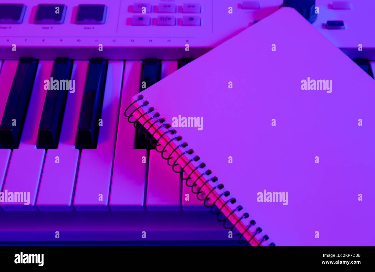 Close-up, notepad on musical keys in neon lighting Stock Photo - Alamy