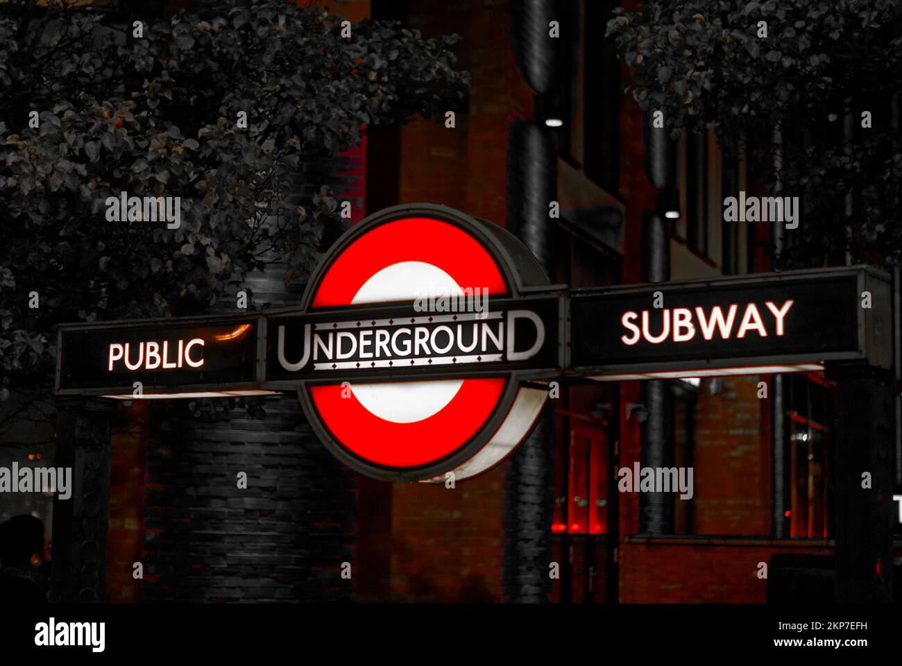 An exterior view of Manor House tube station at night in London, United ...