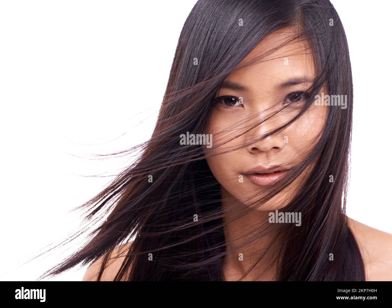 Simply irresistible. a beautiful young oriental woman against a white background Stock Photo - Alamy