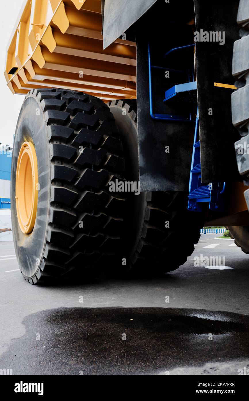 Big truck. Wheel and tire of large industrial mining machine Stock ...