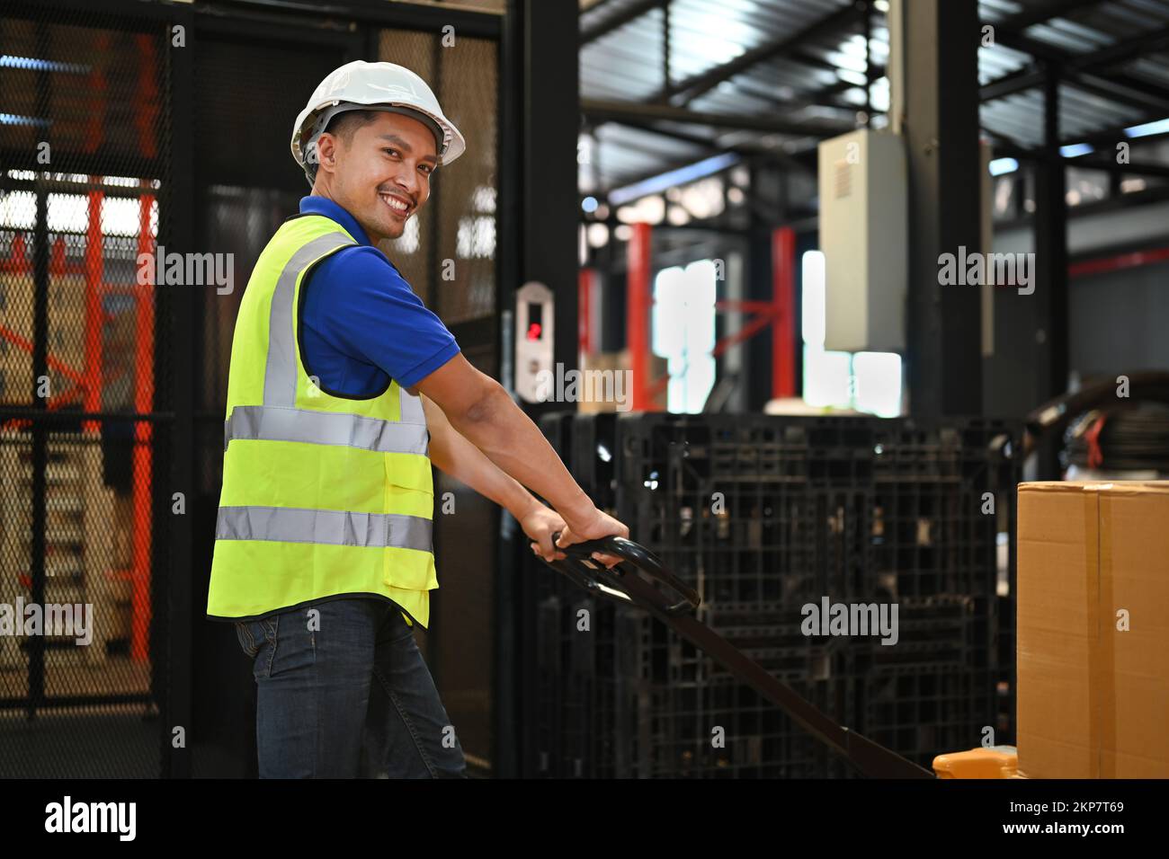 Warehouse pulling pallet truck boxes hi-res stock photography and ...