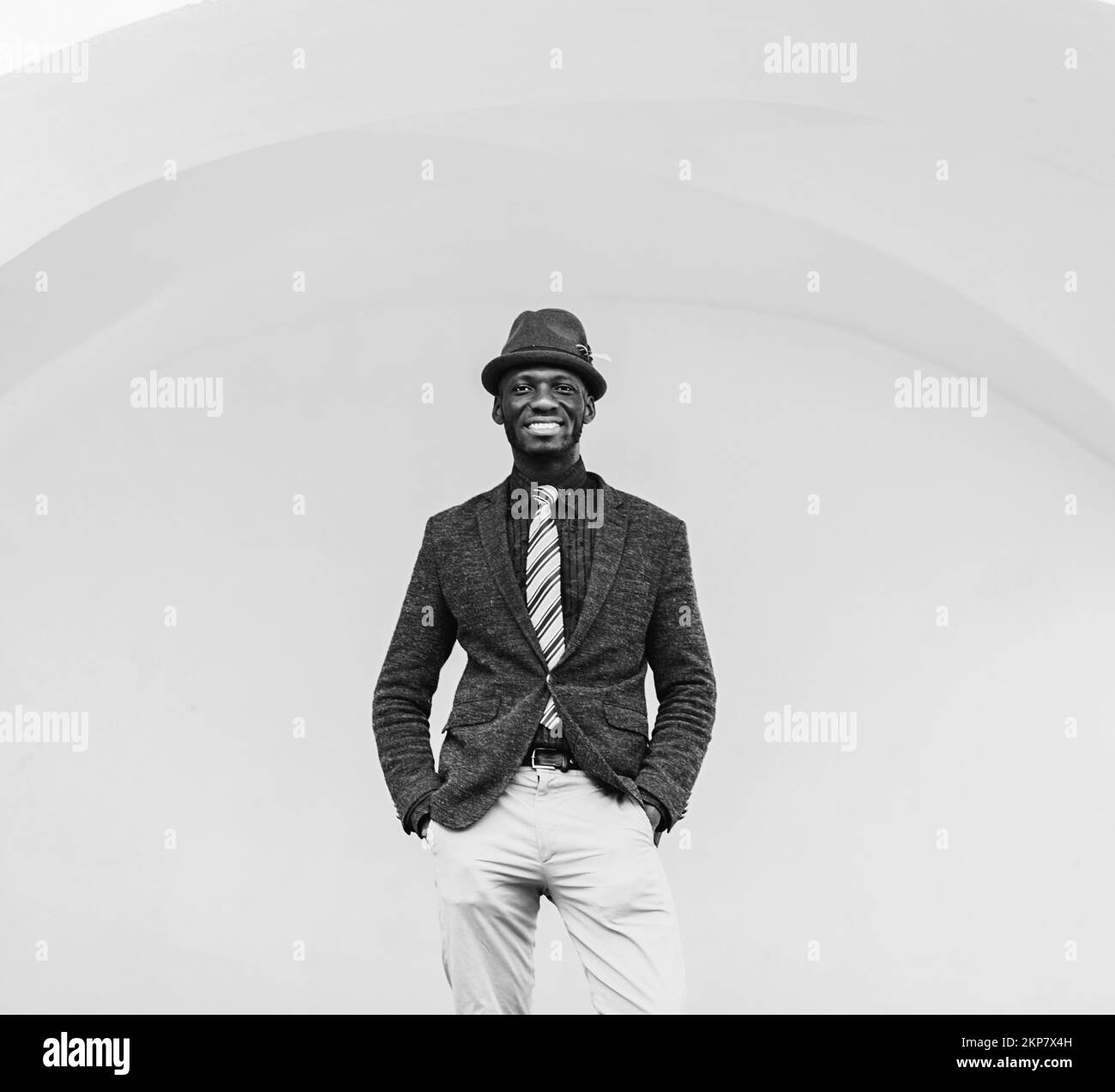 fashionable african man in suit with tie and hat Stock Photo - Alamy