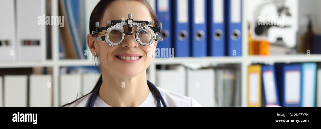 Ophthalmologist wear optometrist trial frame at ophthalmology office, select glasses for better ...