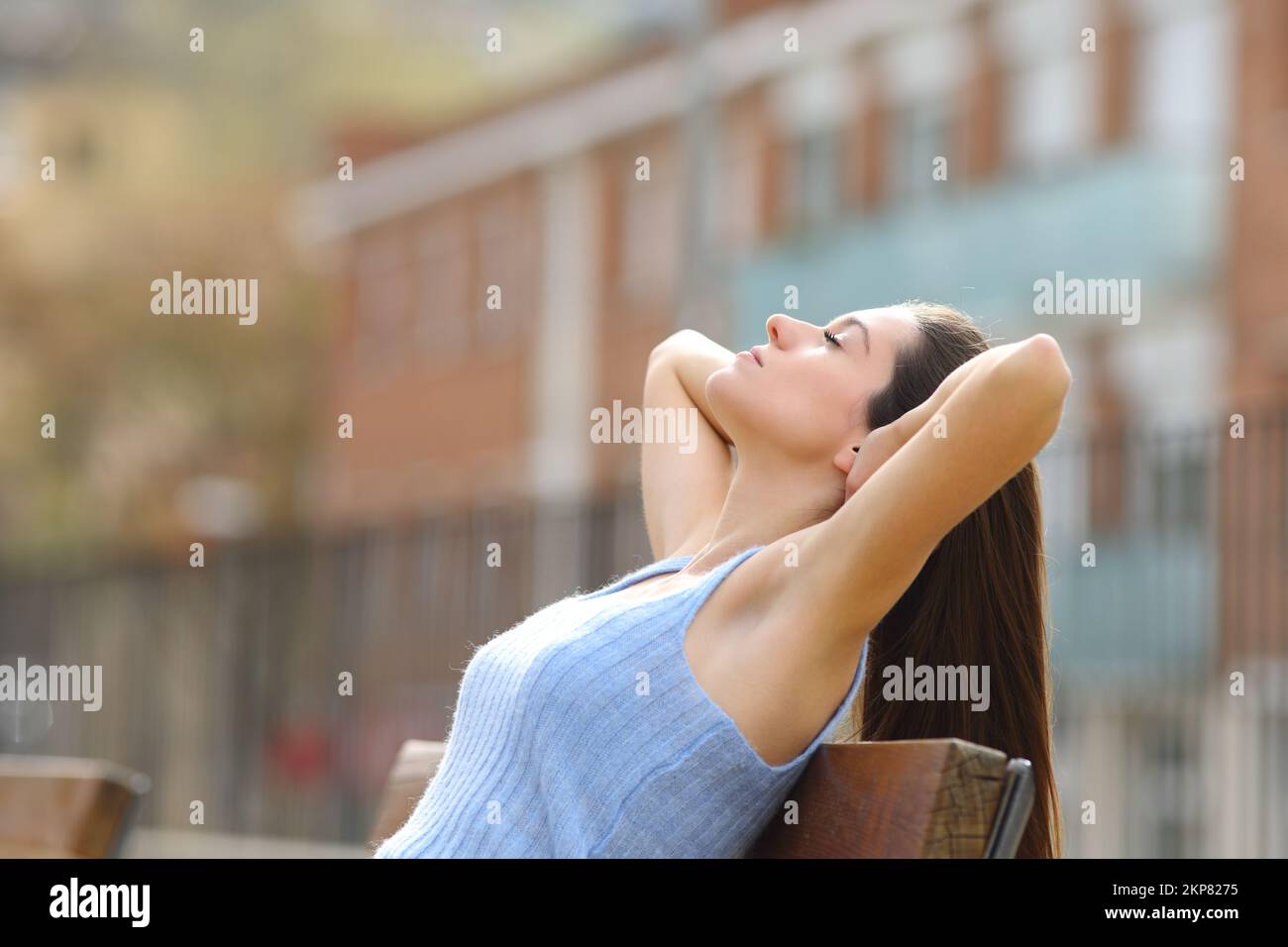 Profile of a teen relaxing in a bench Stock Photo - Alamy