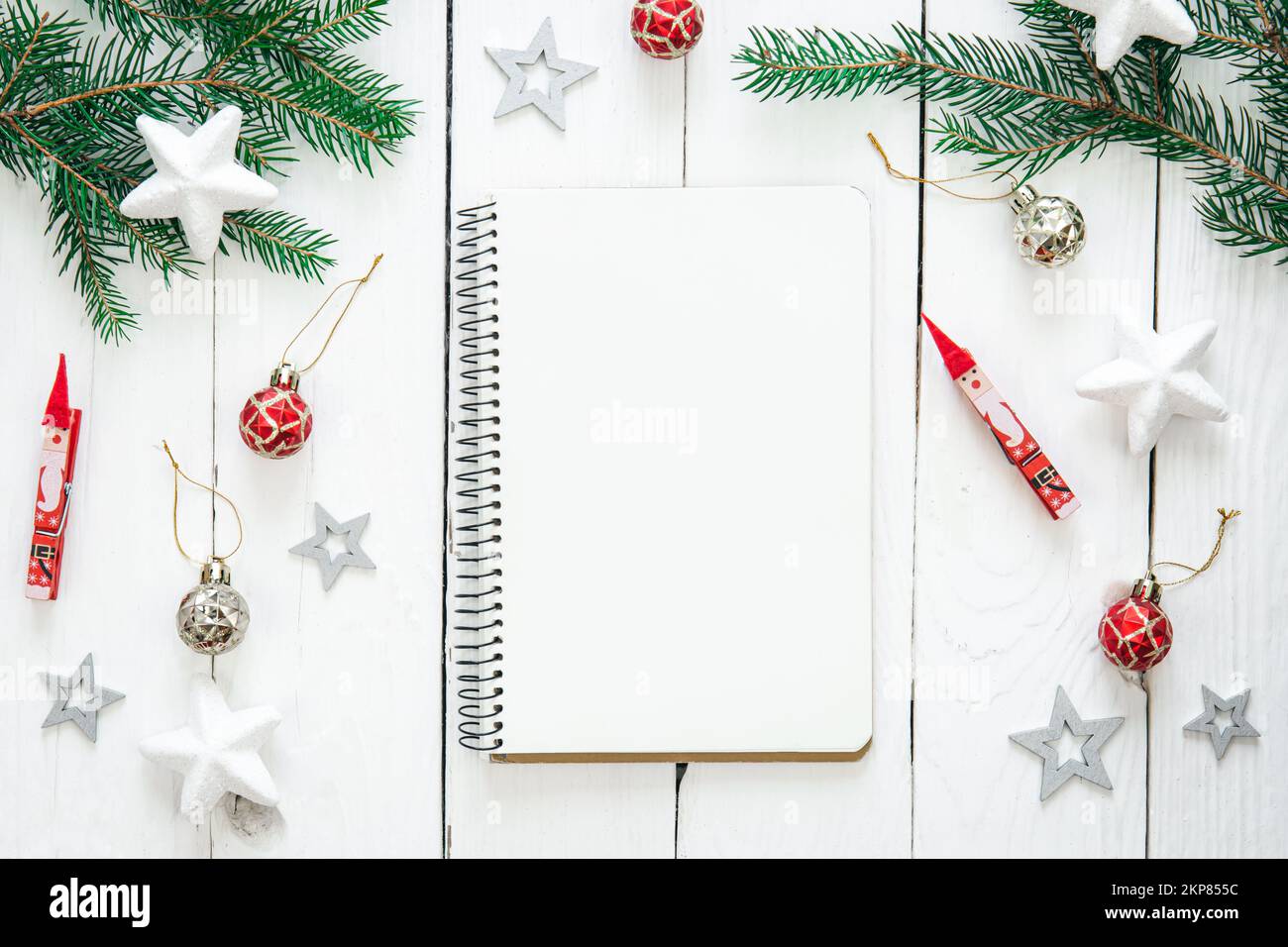 Christmas background with notepad and decor details on a white ...