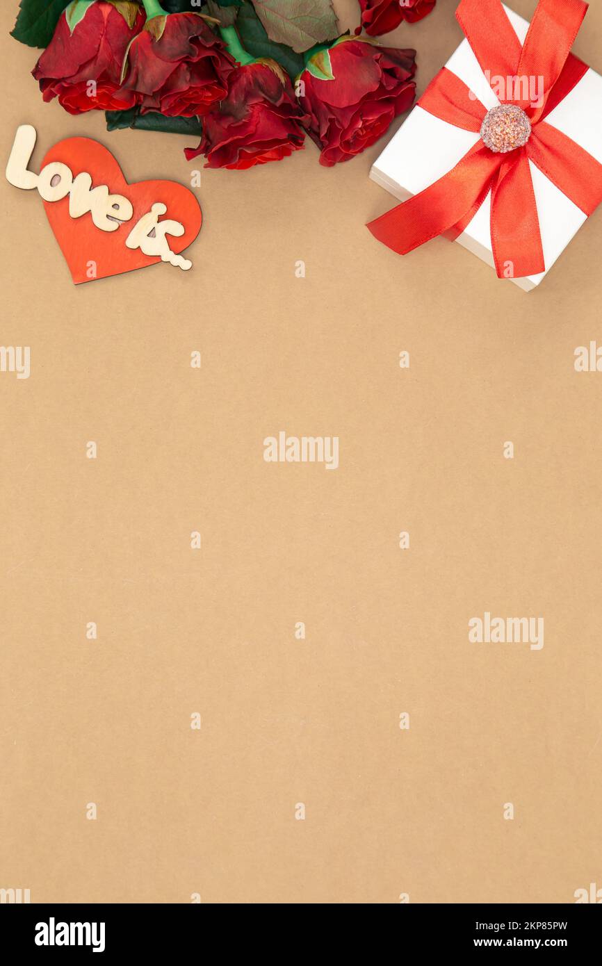 Valentine's Day background with rose bouquet and gift box, flat lay ...