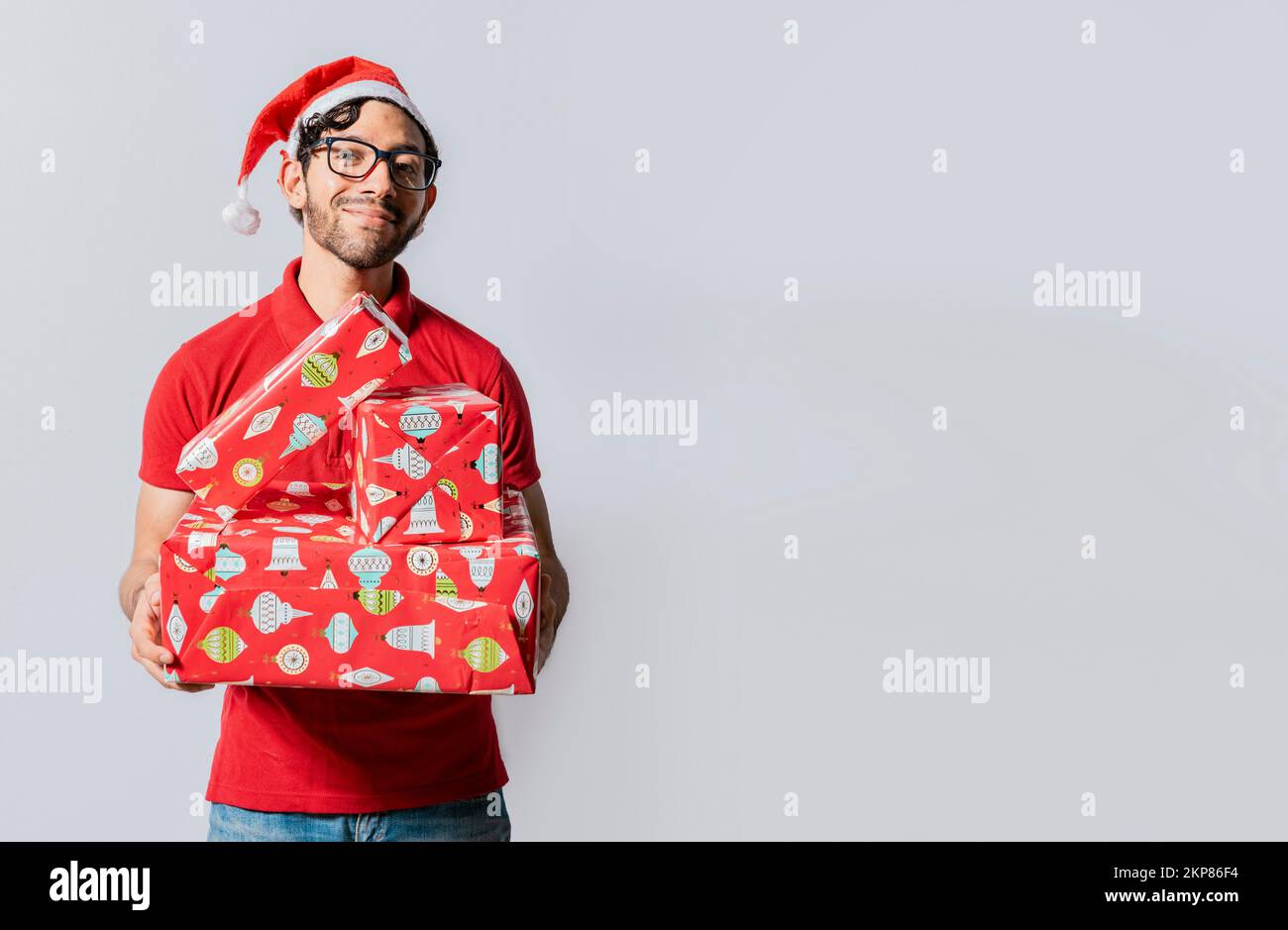 Christmas man portrait holding gift boxes and smiling isolated. Smiling ...