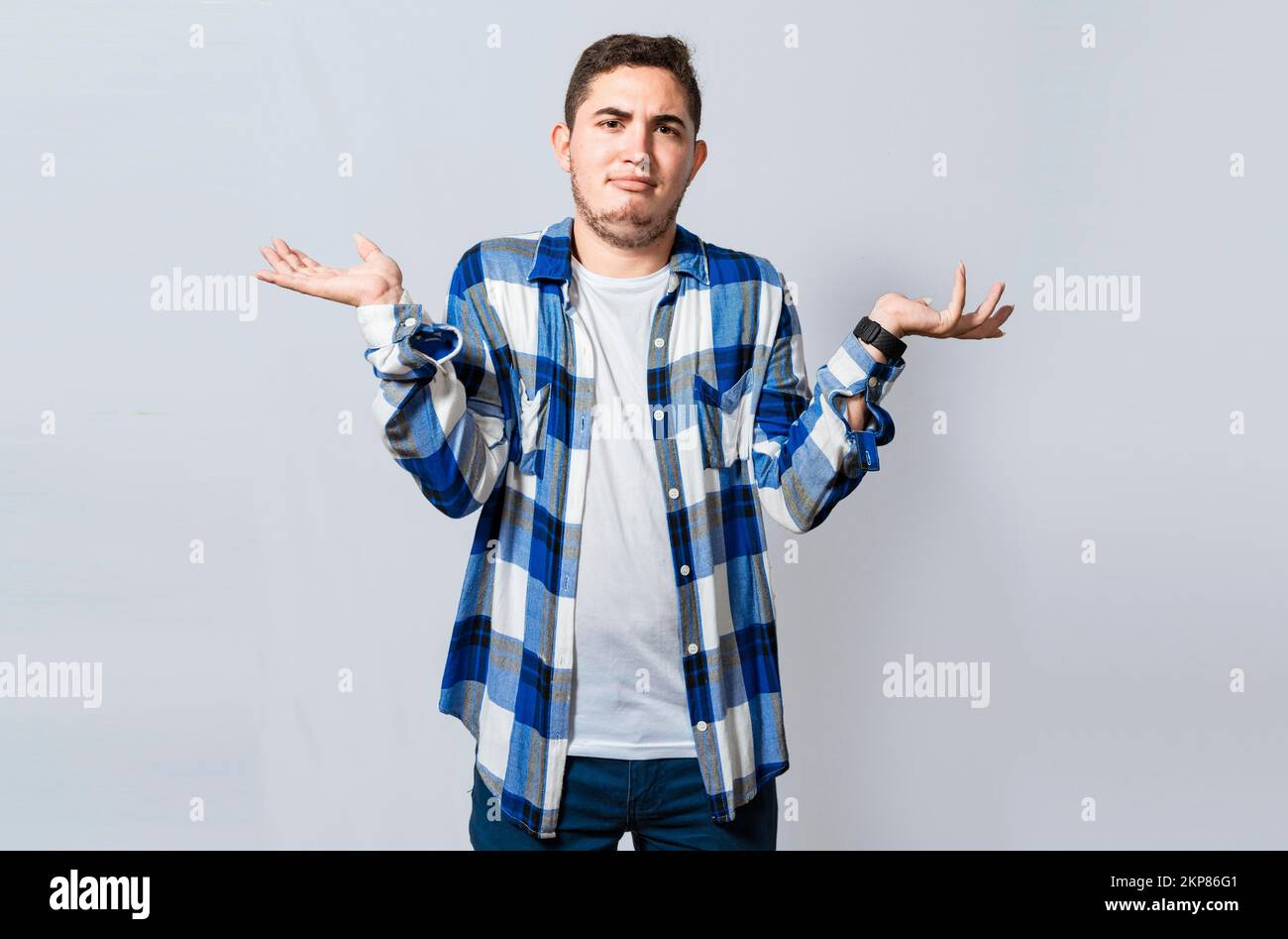 Man spreading palms, feeling clueless and uncertain. Person with ...