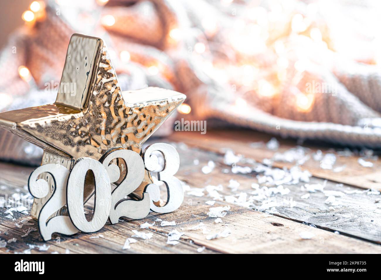 Christmas background with decorative numbers 2023, a star and a knitted ...