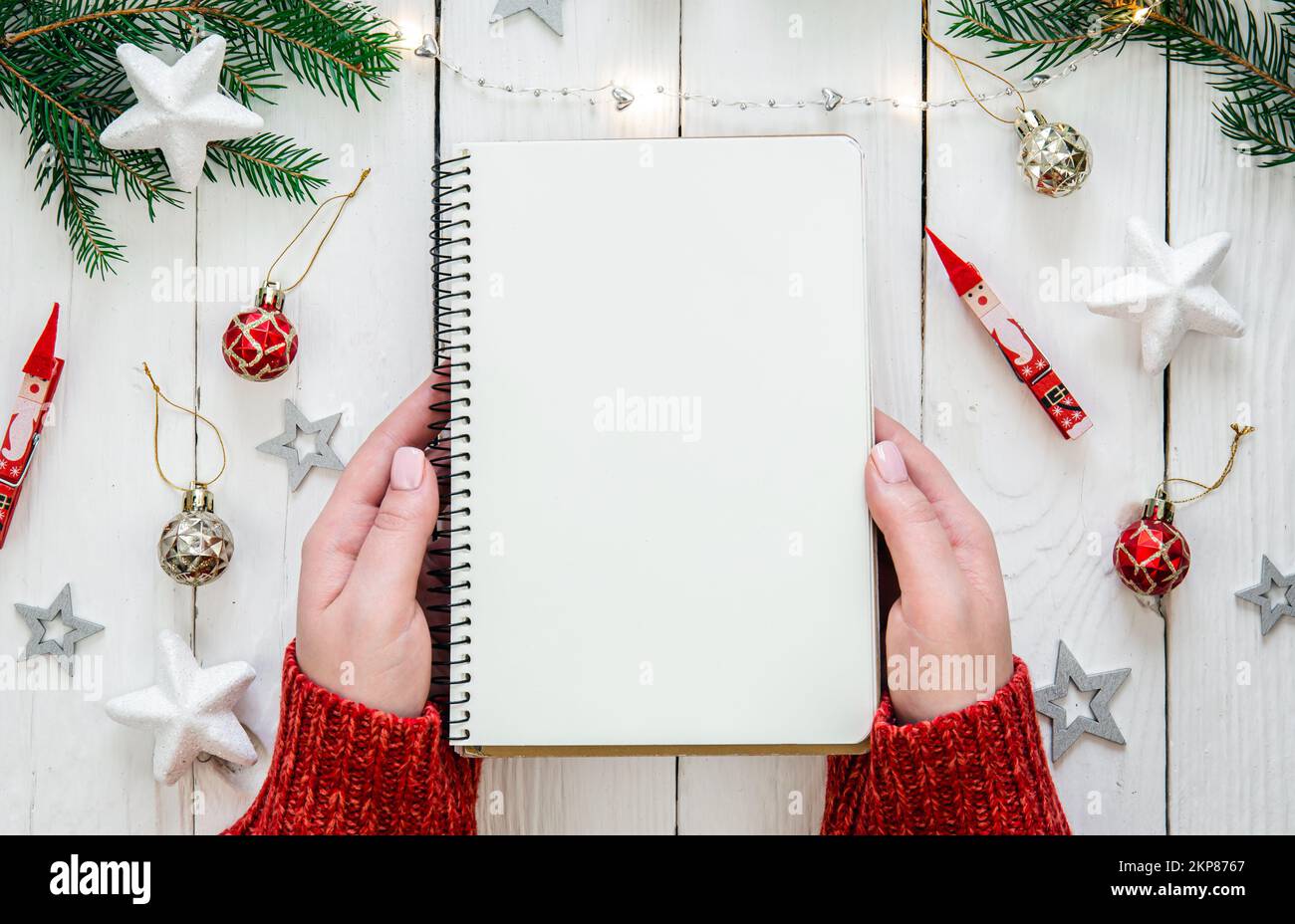 Christmas background with notepad and decor details on a white ...