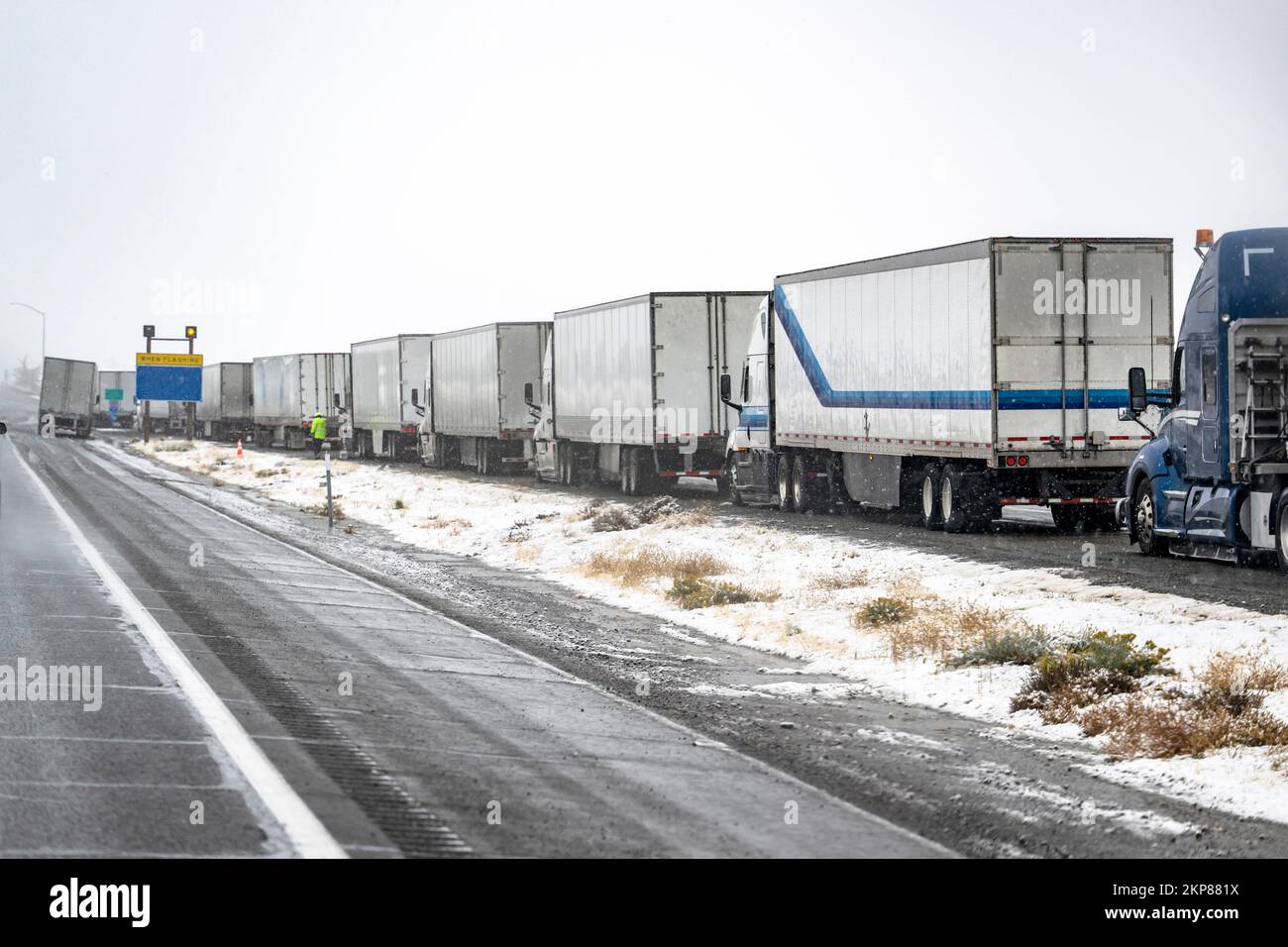 Convoy of industrial big rigs semi trucks with semi trailers ...