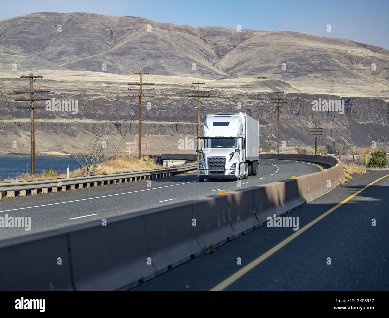 Industrial white long haul big rig semi truck tractor transporting ...