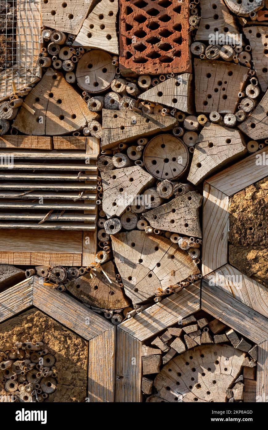 Insect hotel made of natural materials such as clay, stone, brick, wood ...