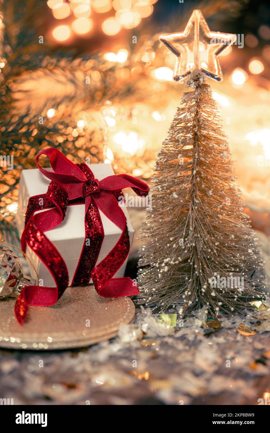 Christmas composition with a decorative tree and a gift box Stock Photo ...