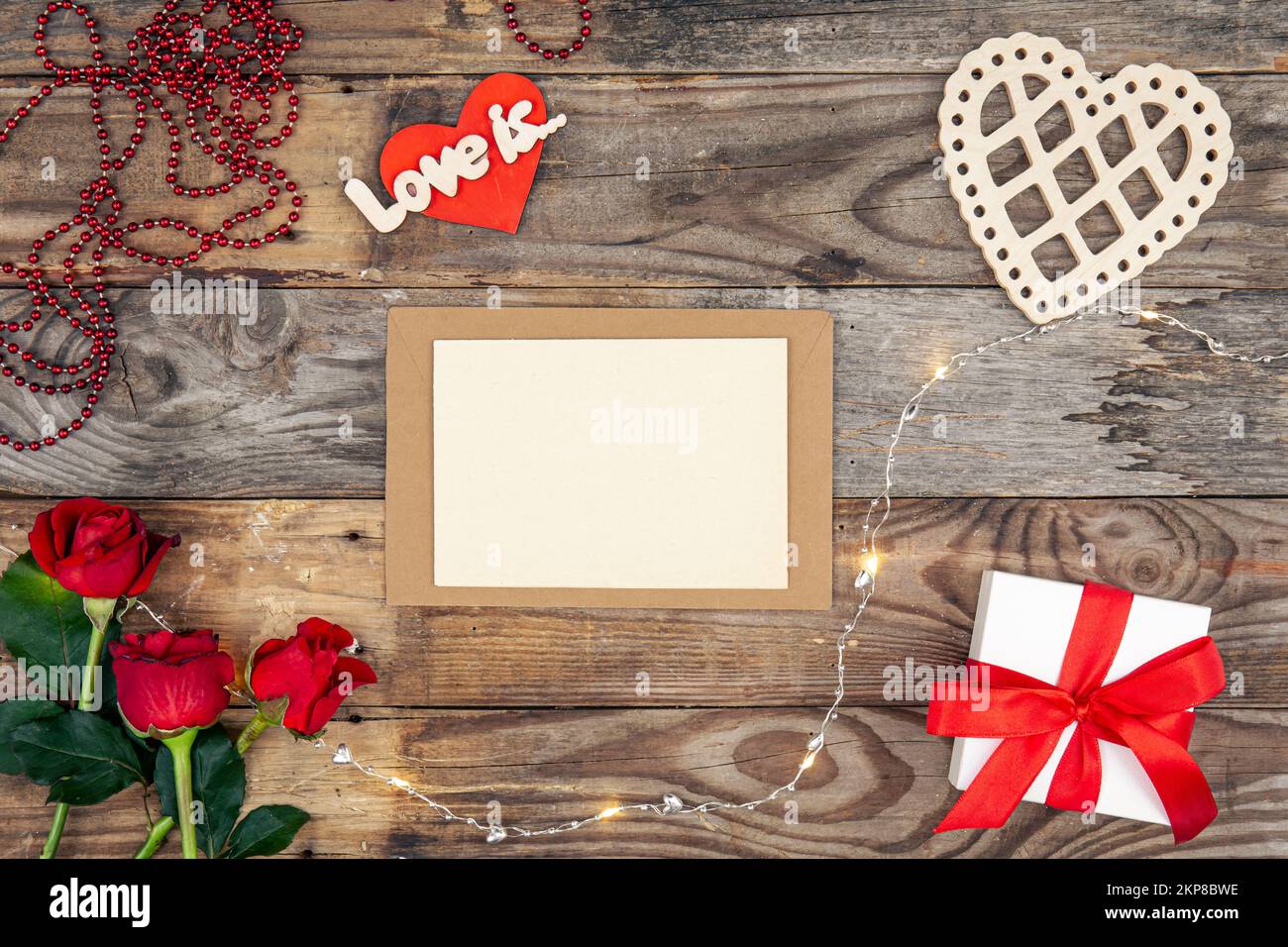 Envelope and blank paper on wooden background, Valentine's day concept ...