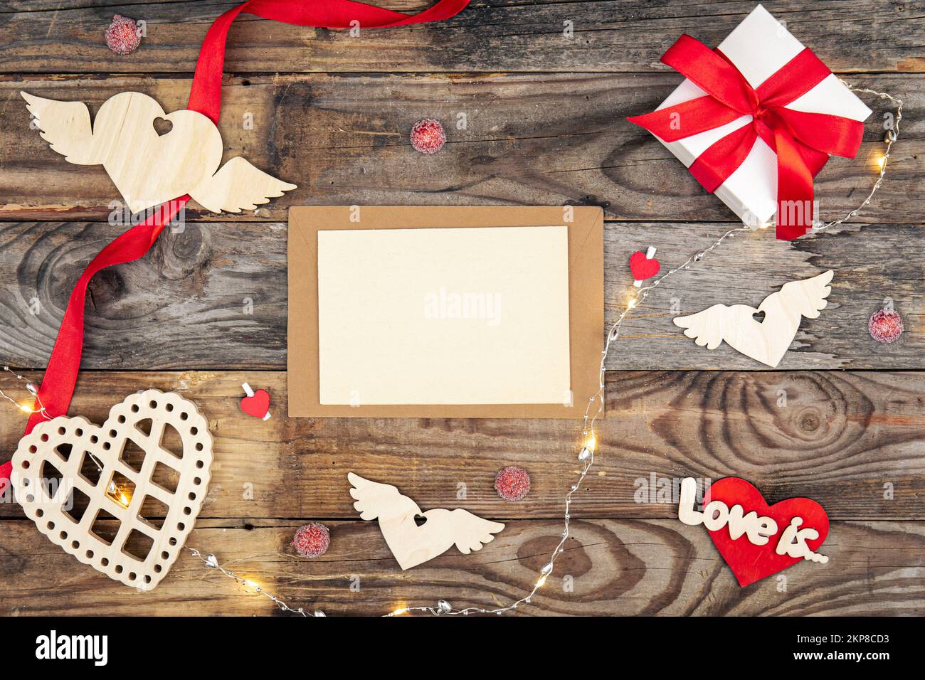 Envelope and blank paper on wooden background, Valentine's day concept ...
