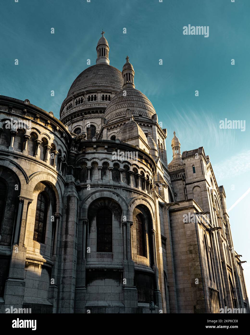 A low angle view of Sacred Heart of Montmartre building facade under ...