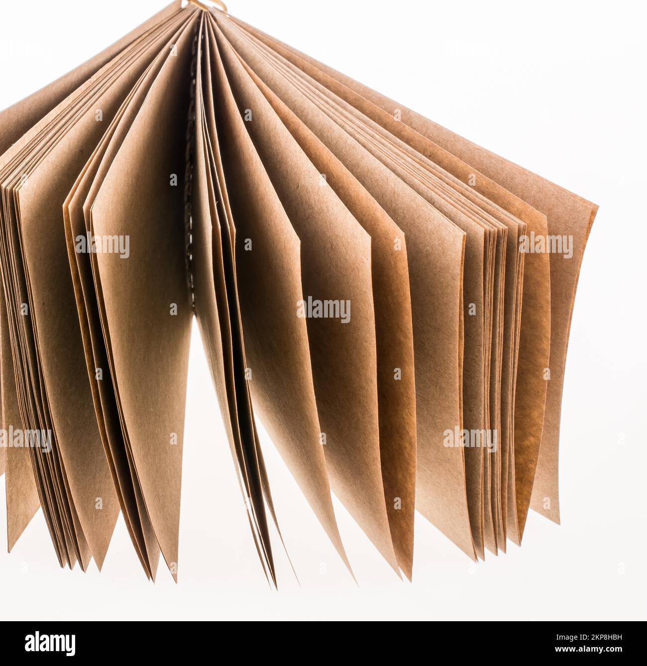 Brown notebook pages open on a white background Stock Photo - Alamy