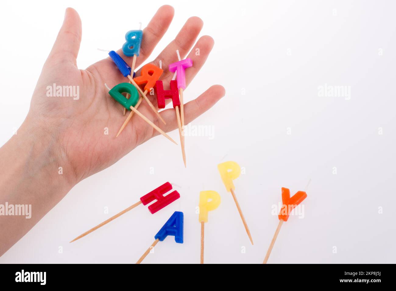 Colored envelopes and Color candles on sticks write happy Stock Photo ...