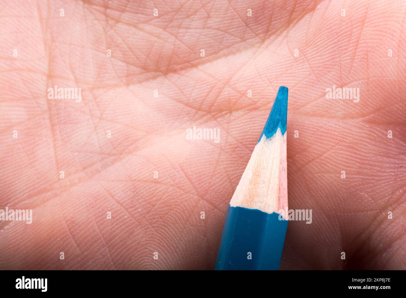 Hand holding color pencil on a white background Stock Photo - Alamy