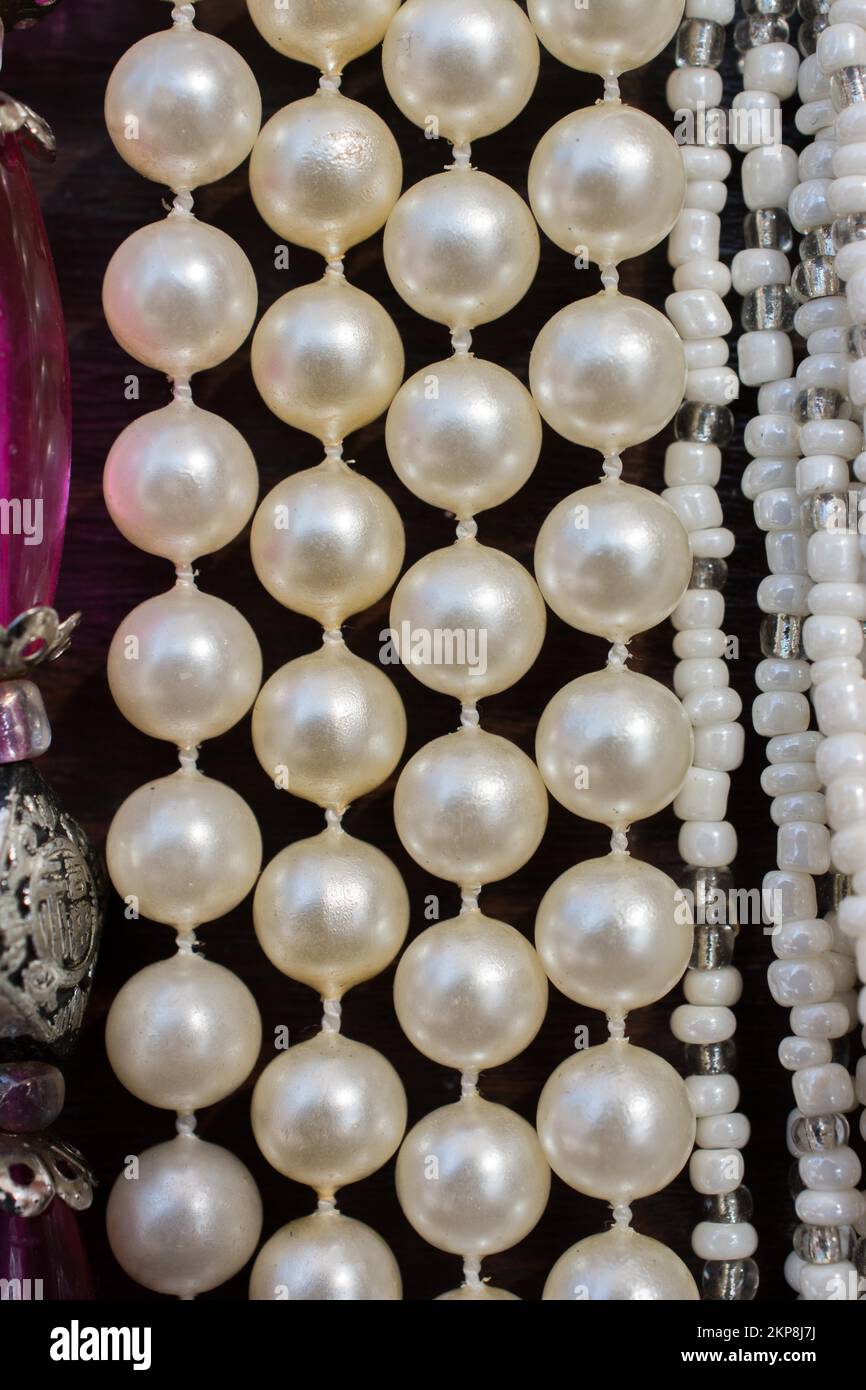 Pearl beads background with many shiny pearls in view Stock Photo - Alamy