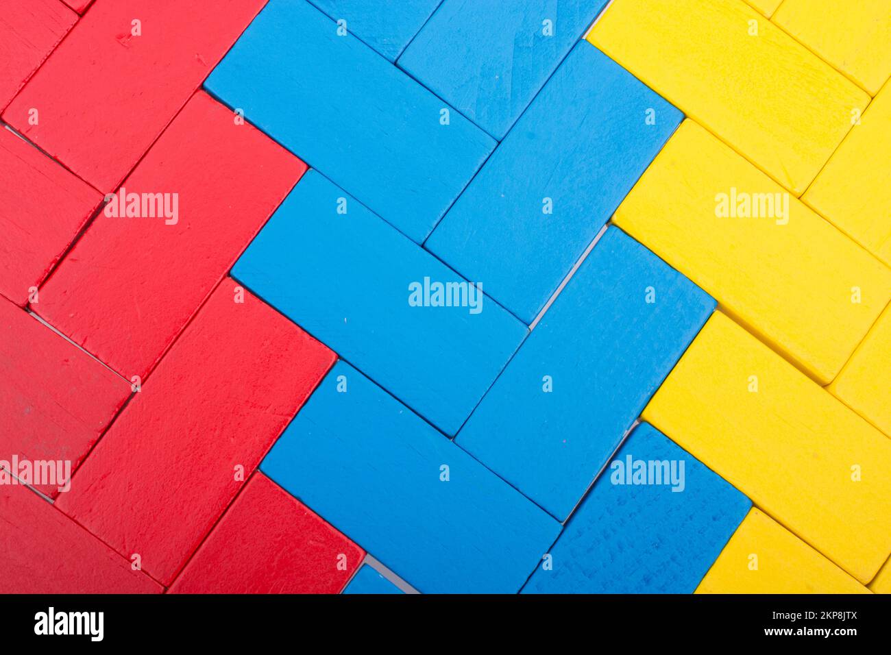 Colorful Domino Blocks in a line on a white background Stock Photo - Alamy