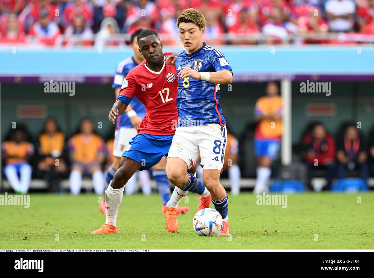 Ritsu Doan (8) of Japan and Joel Campbell (12) of Costa Rica during the ...