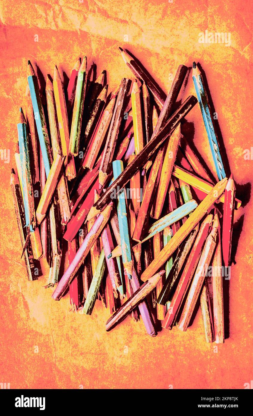 Grunge object art on a messy stack of rough pencils in rugged colors ...